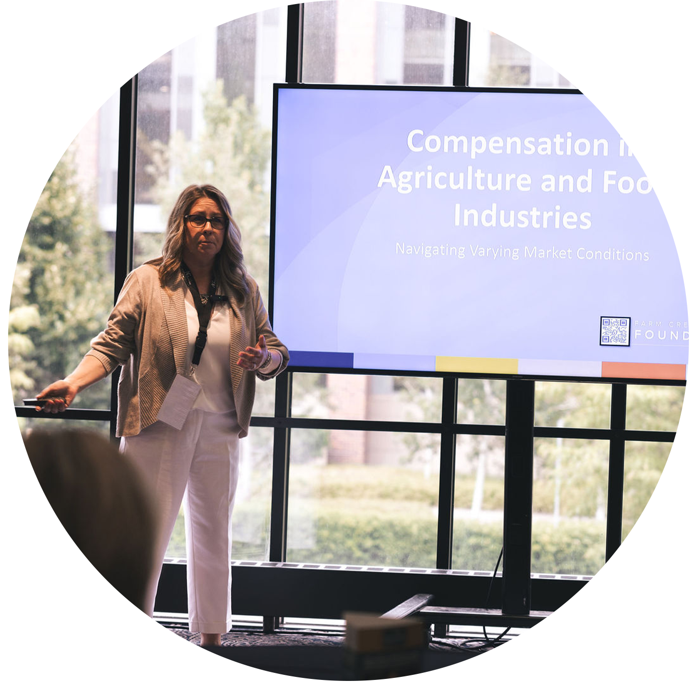 Woman presenting at a Compensation Summit